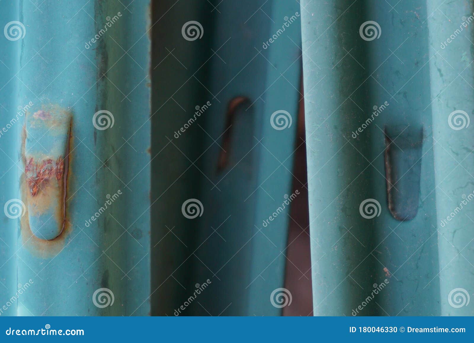 Rusting blue metal stakes stock photo. Image of blue - 180046330
