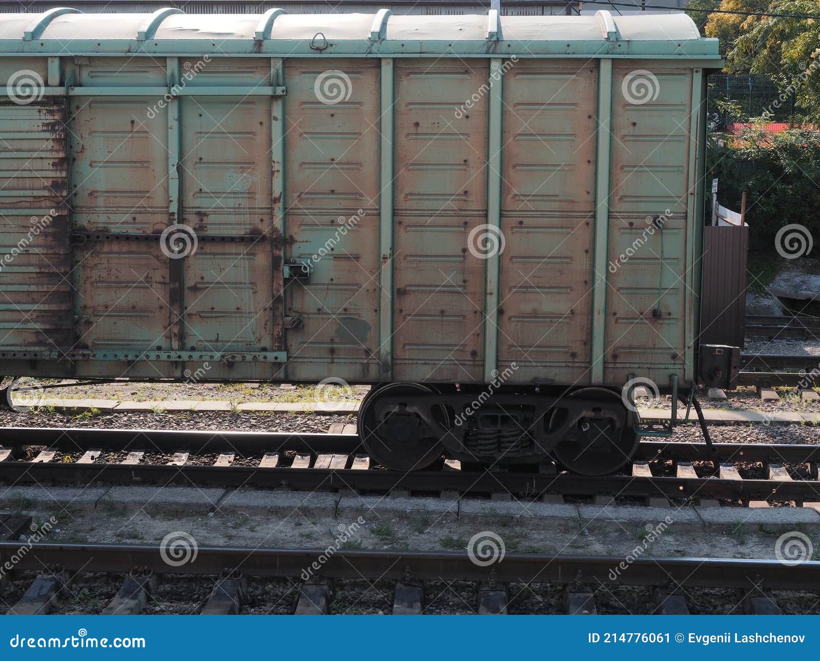 The Rusting Iron Wagon Of A Freight Train Stands On The Rails In Depo ...