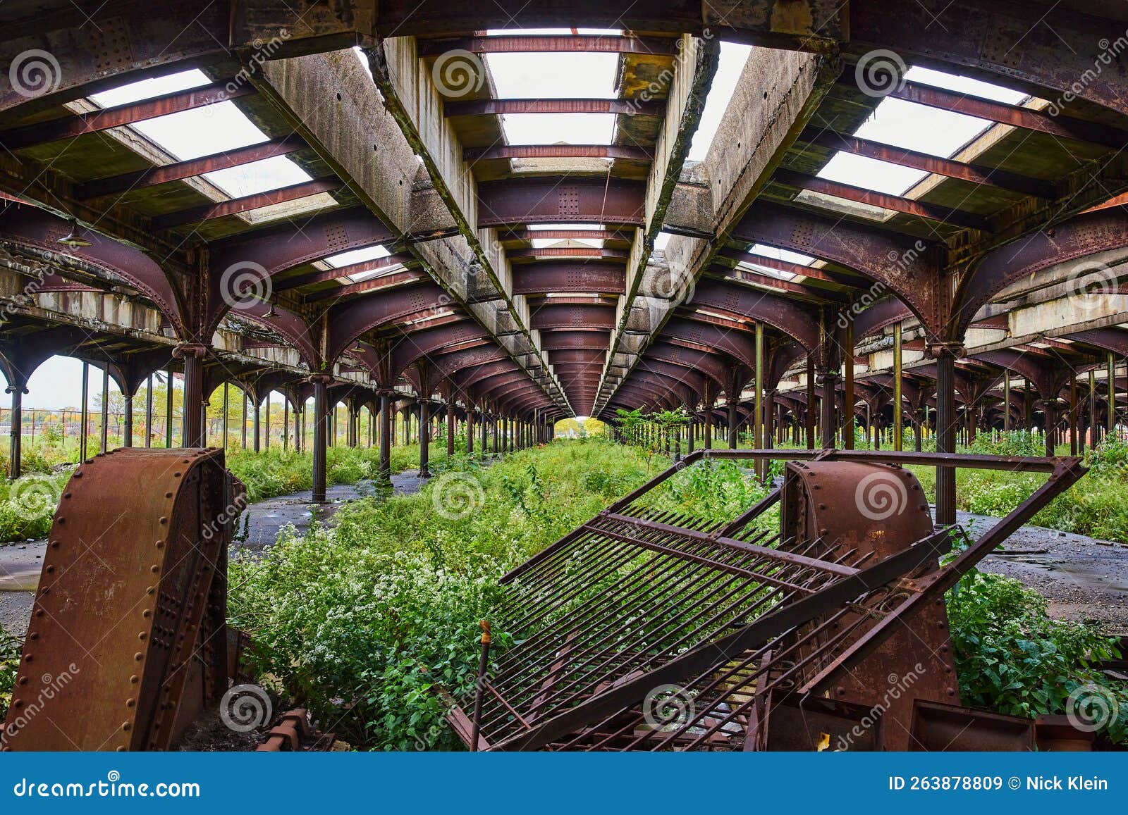 Rusting Steel and Overgrowth in Abandoned Outside Train Station with ...
