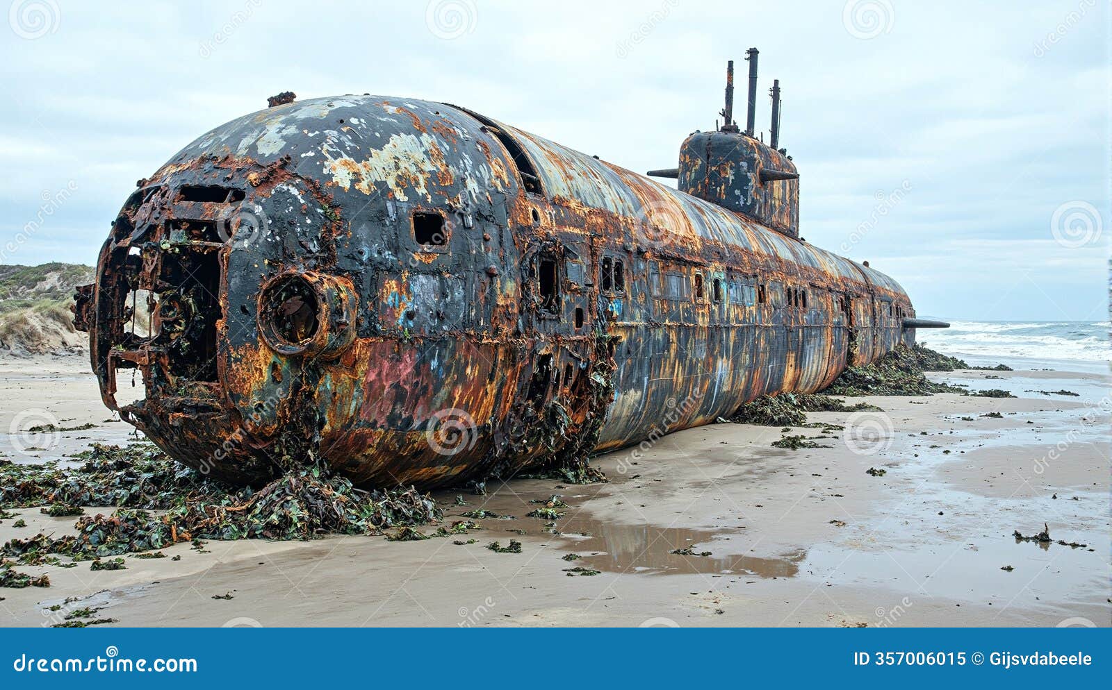 Rusting Submarine Stranded on Beach Covered in Barnacles and Seaweed ...