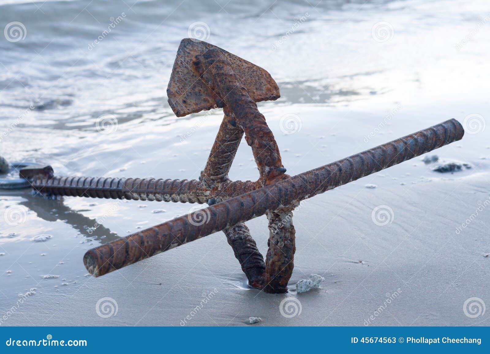 Rusty anchor on the beach stock image. Image of strength - 45674563