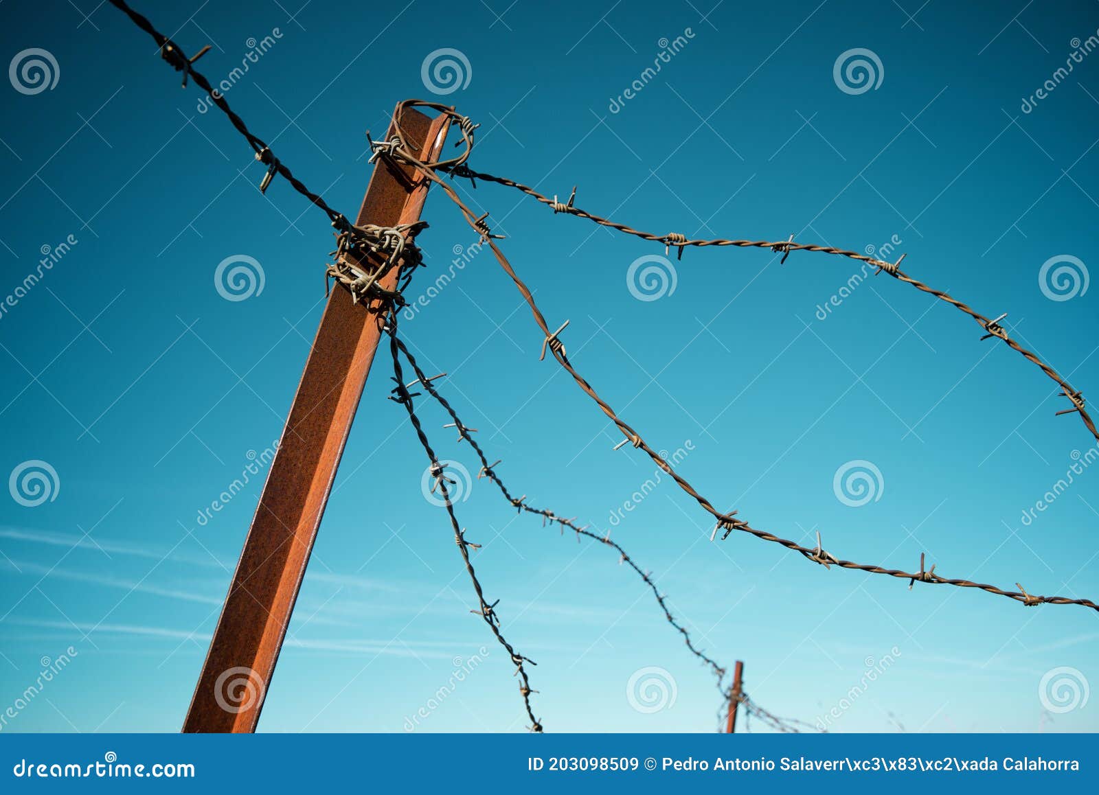 Rusty barbed wire fence stock image. Image of protection - 203098509