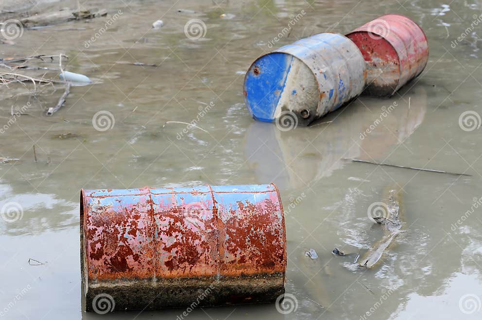 Rusty Barrels Floating in River Stock Photo - Image of ecology, water ...