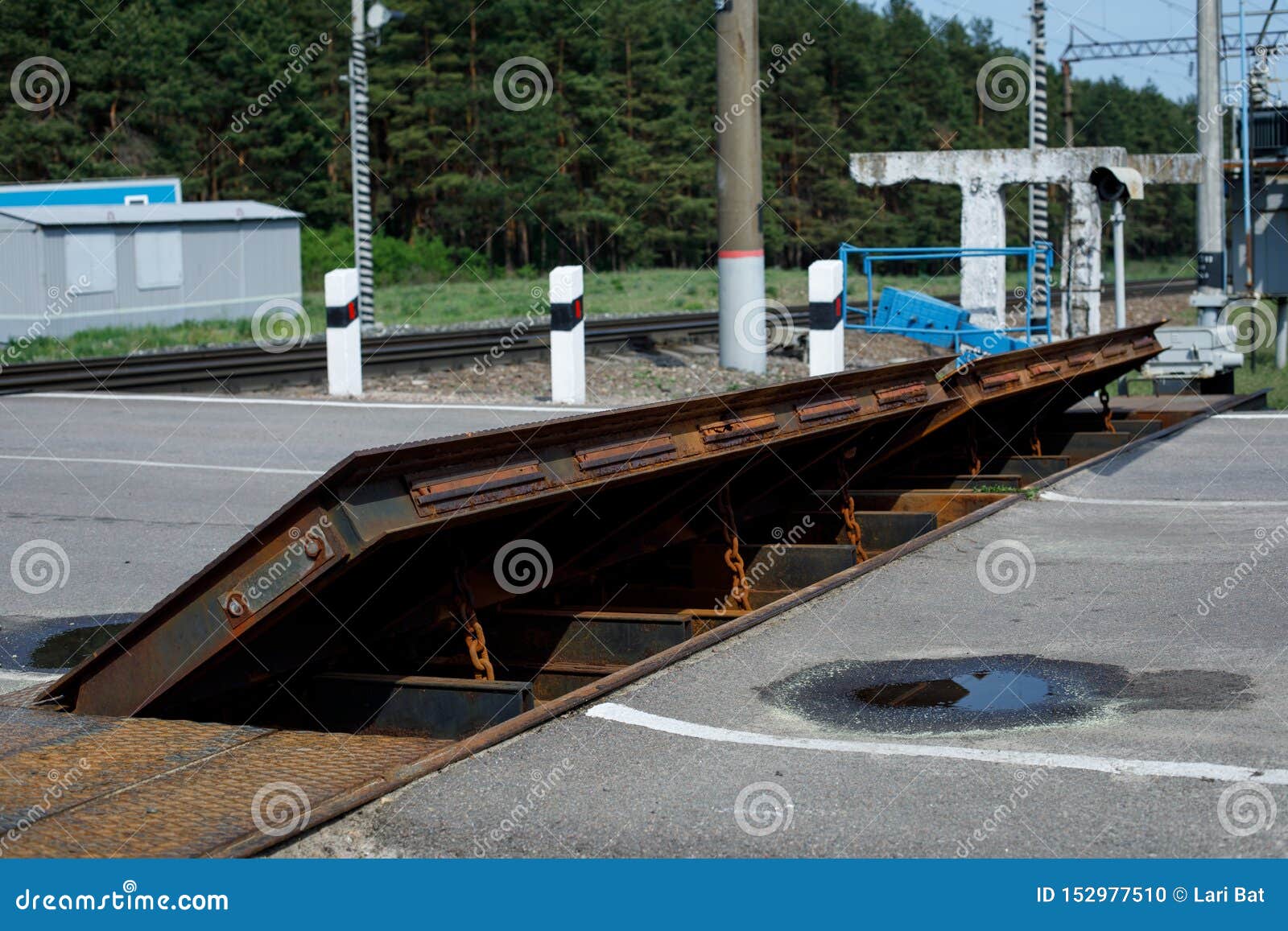 Rusty Barrier at a Railway Crossing Against the Background of the ...