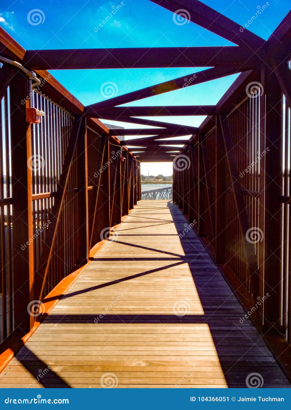 Rusty Pedestrian Bridge With Grate Floor As Pathway Across Artificial ...