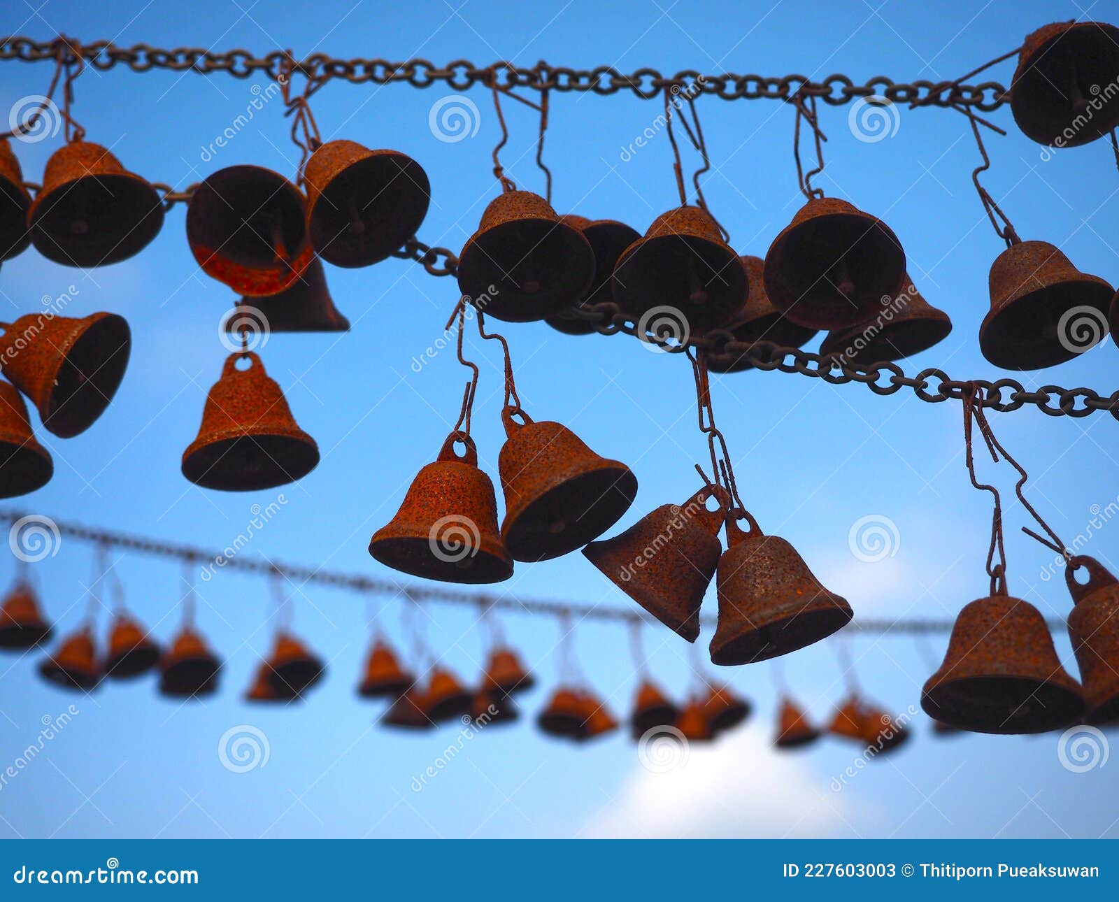 Rusty Bells Chain with Blue Sky Stock Image - Image of legend, copper ...