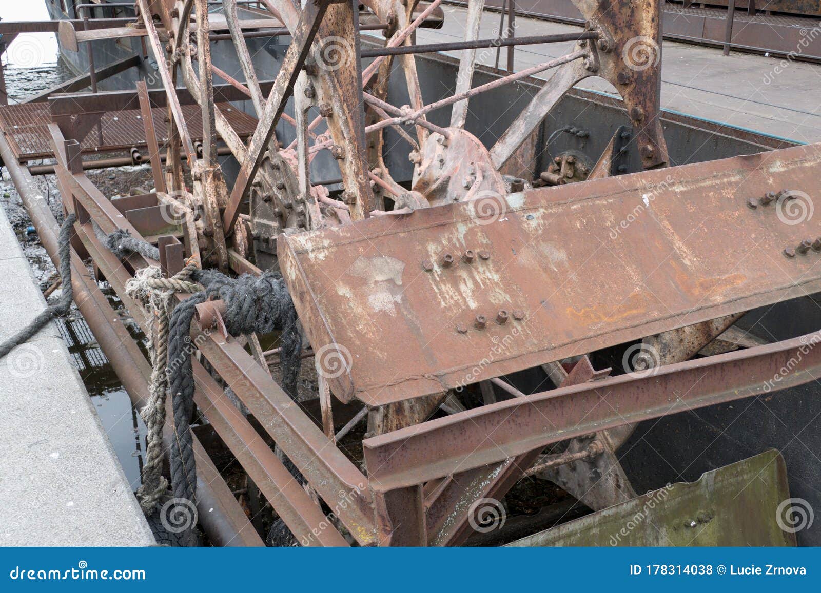 Rusty Boat Engine Wheel on a River Stock Photo - Image of dock ...