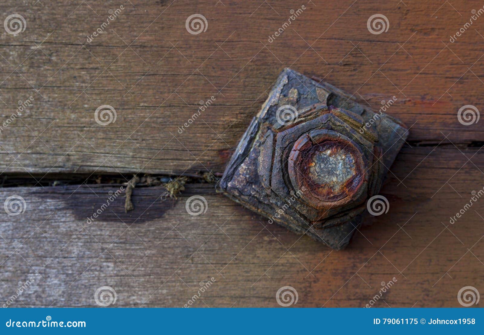 Rusty bolt through timber. stock image. Image of worn - 79061175