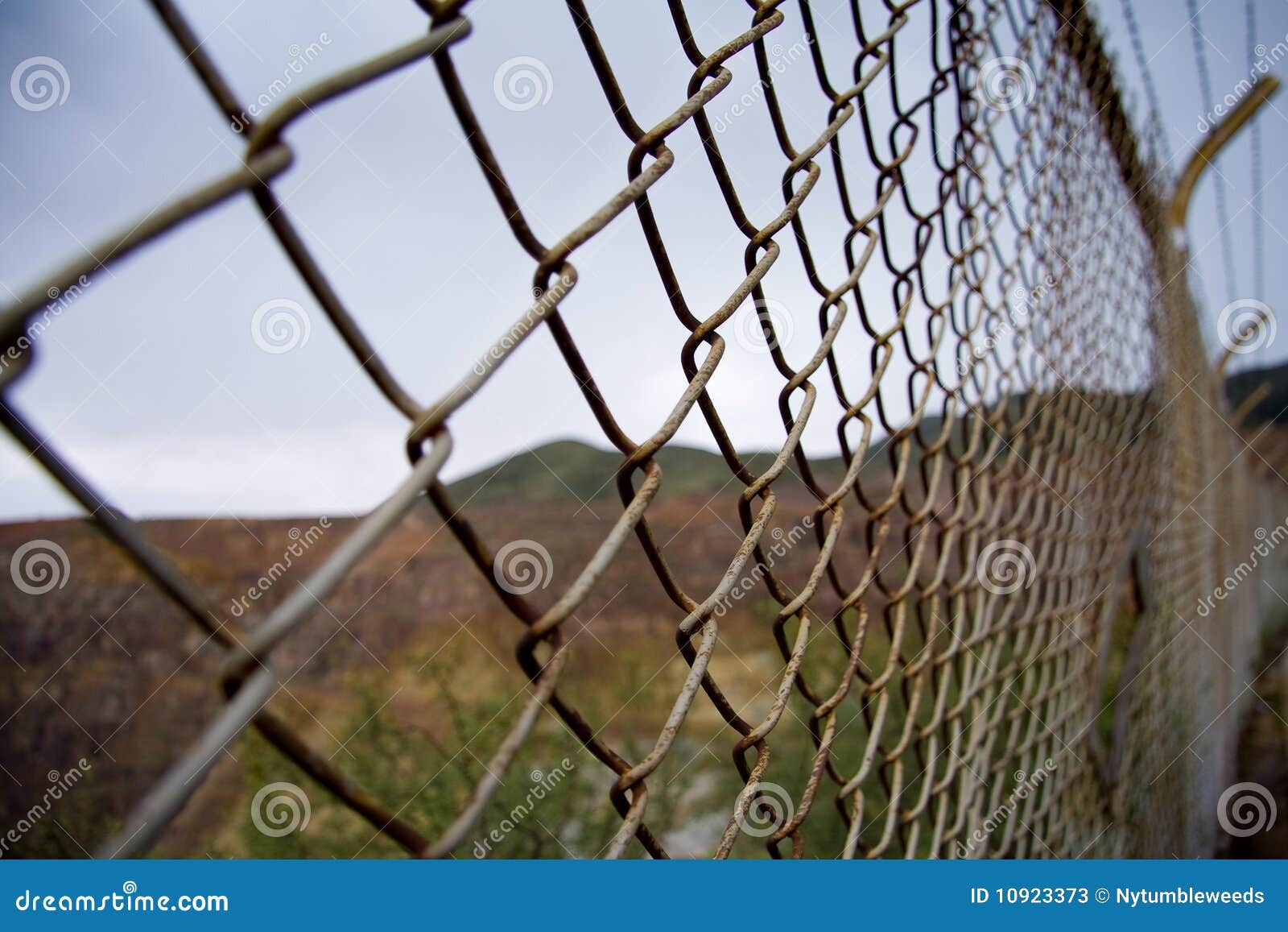 Rusty border fence stock image. Image of iron, barbed - 10923373