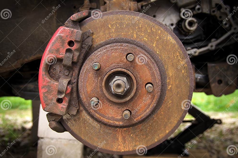 Rusty Brake Disc and Pad on a Broken Car in the Yard Stock Photo ...