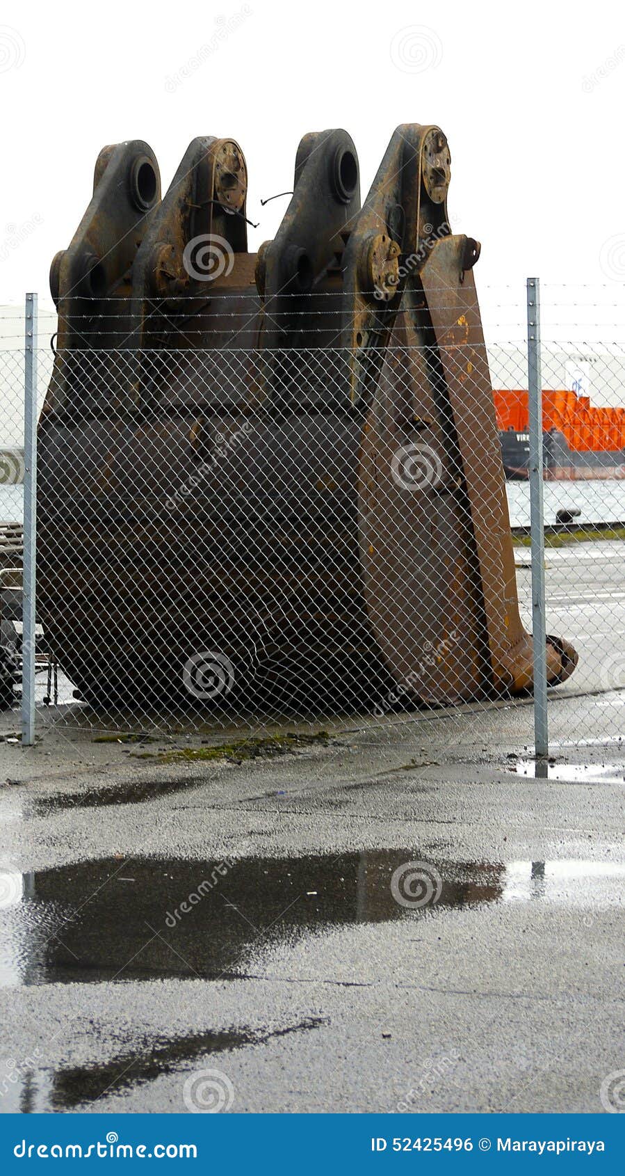 Rusty bucket at harbor stock photo. Image of mesh, backhoe - 52425496