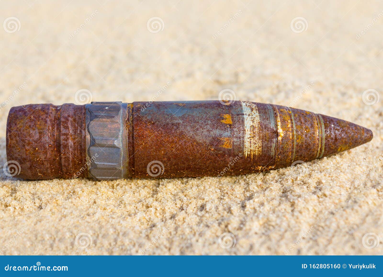 Rusty Bullet Lie On A Sand Background Stock Photography | CartoonDealer ...