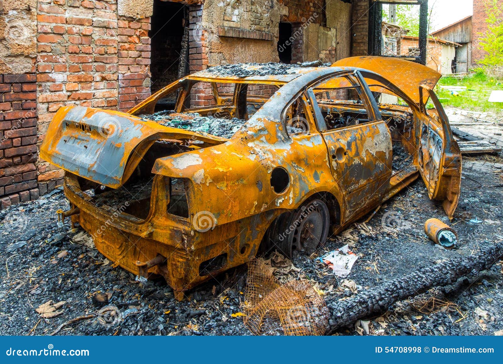 Rusty and burnt car wreck stock photo. Image of plant - 54708998