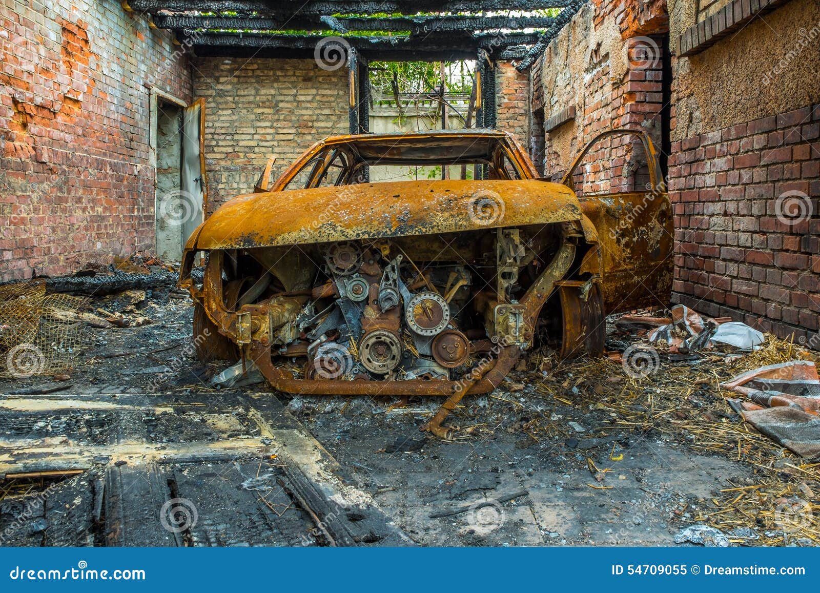 Rusty and burnt car wreck stock image. Image of wall - 54709055
