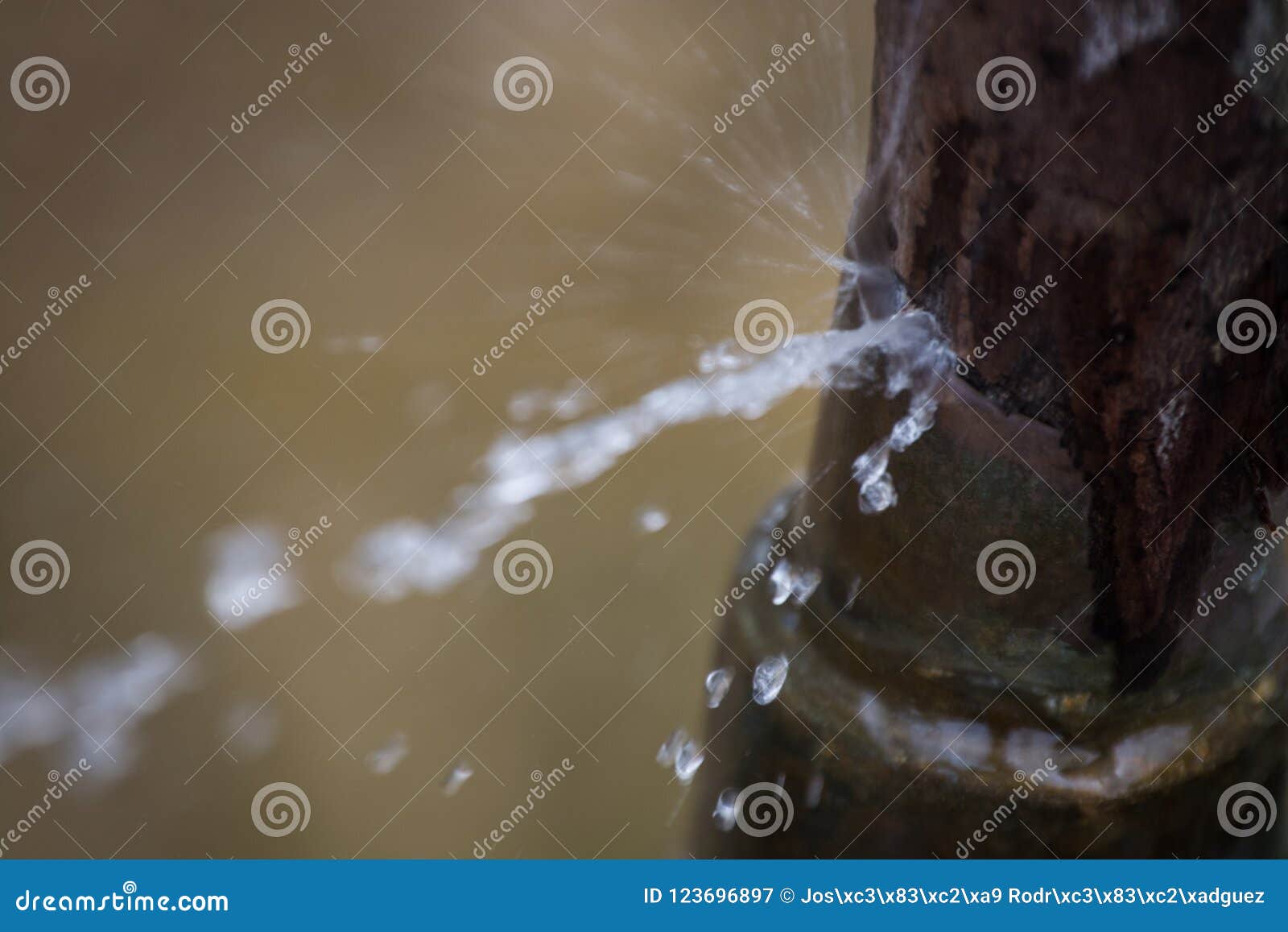 Rusty Burst Pipe Spraying Water in the Ground. Stock Image - Image of ...
