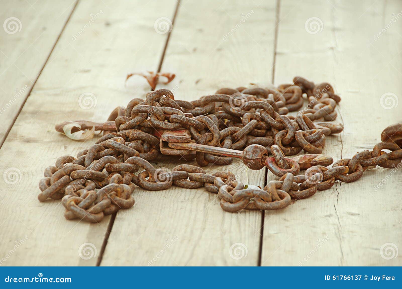 Rusty Chain on Wooden Deck stock image. Image of deck - 61766137