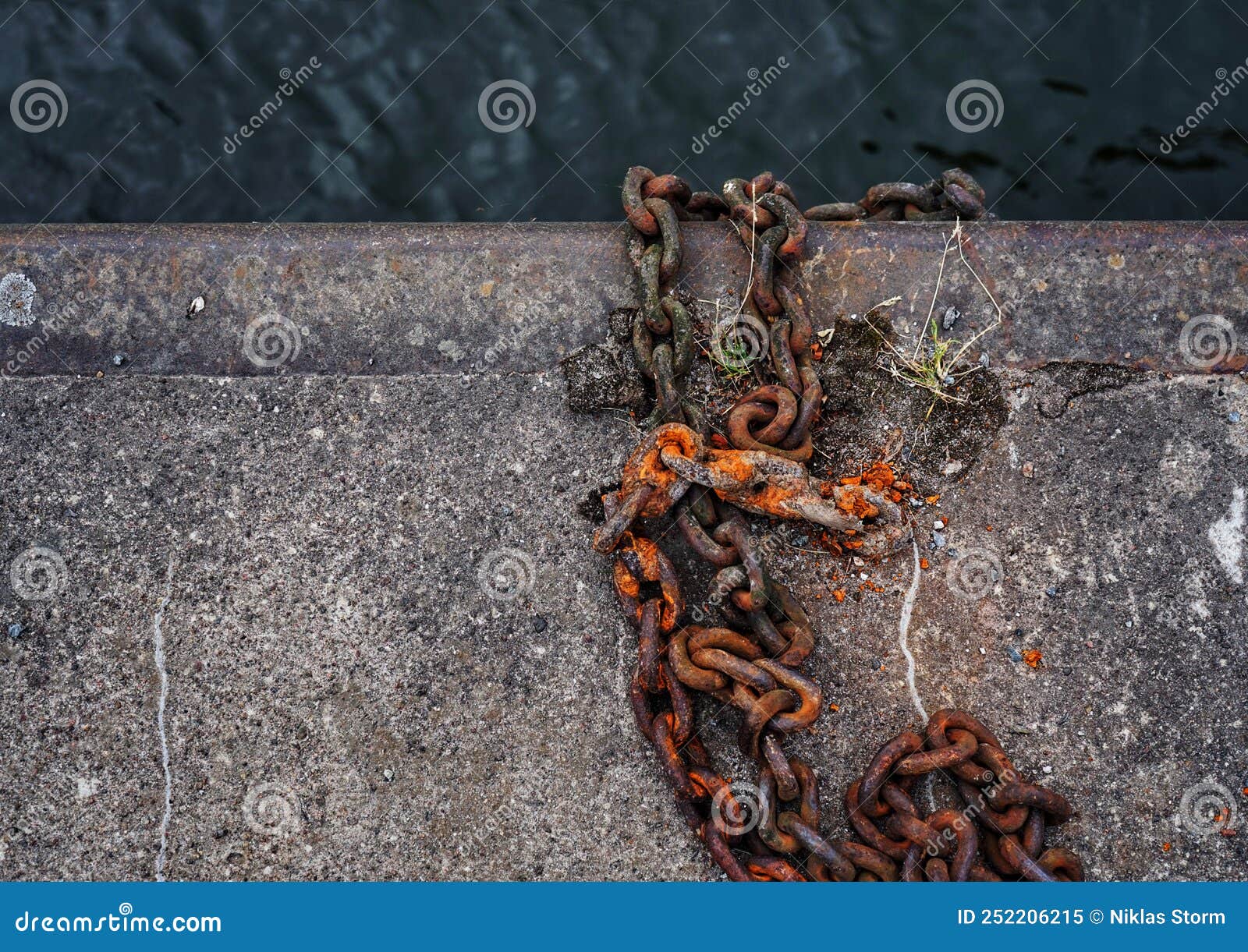 Rusty Chains Lie on the Ground Next To Water Stock Image - Image of ...