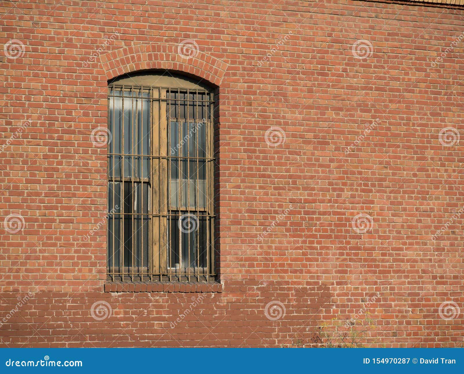 Rusty Gated Window Outside of Brick Warehouse Stock Image - Image of ...
