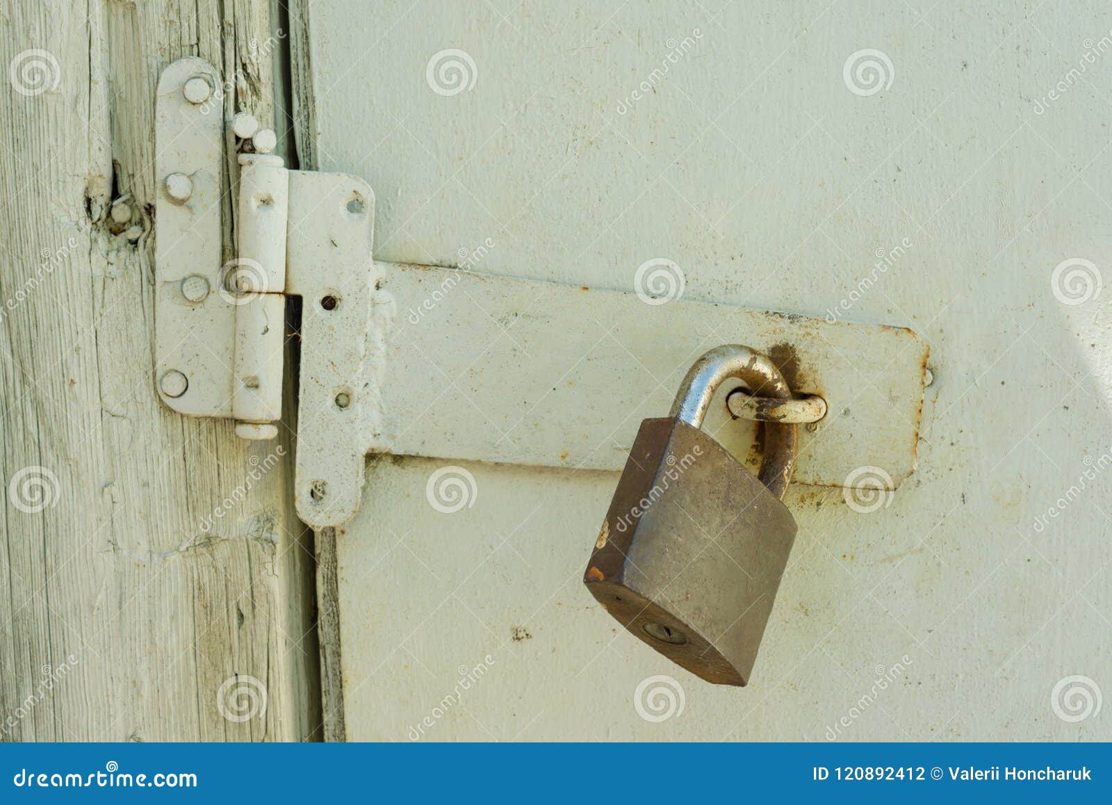 Rusty Closed Lock on Old Wooden White Cracked Painted Door Stock Photo ...