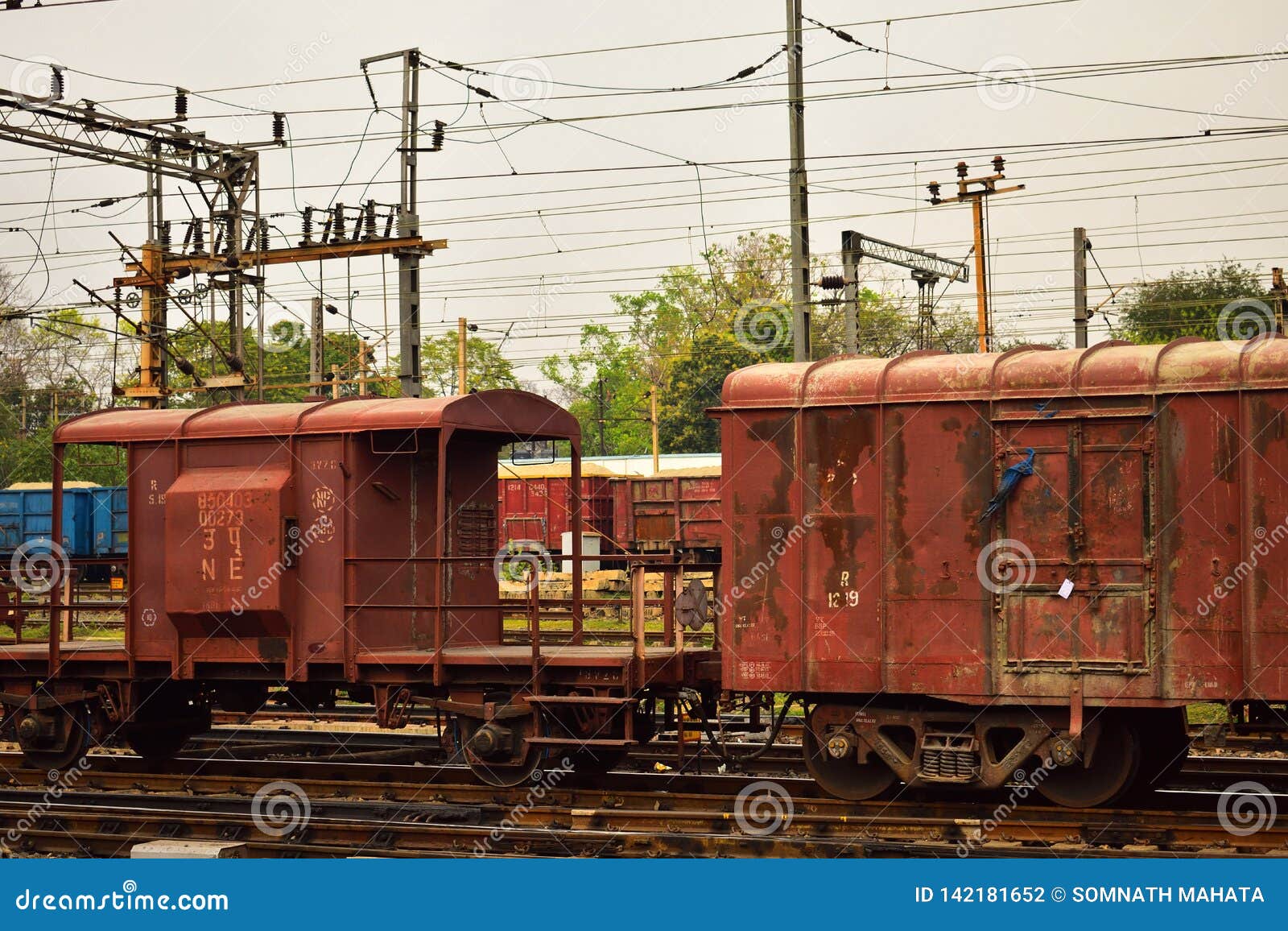 A Rusty Coloured Indian Goods Train Guards Compartment Tied with Goods ...