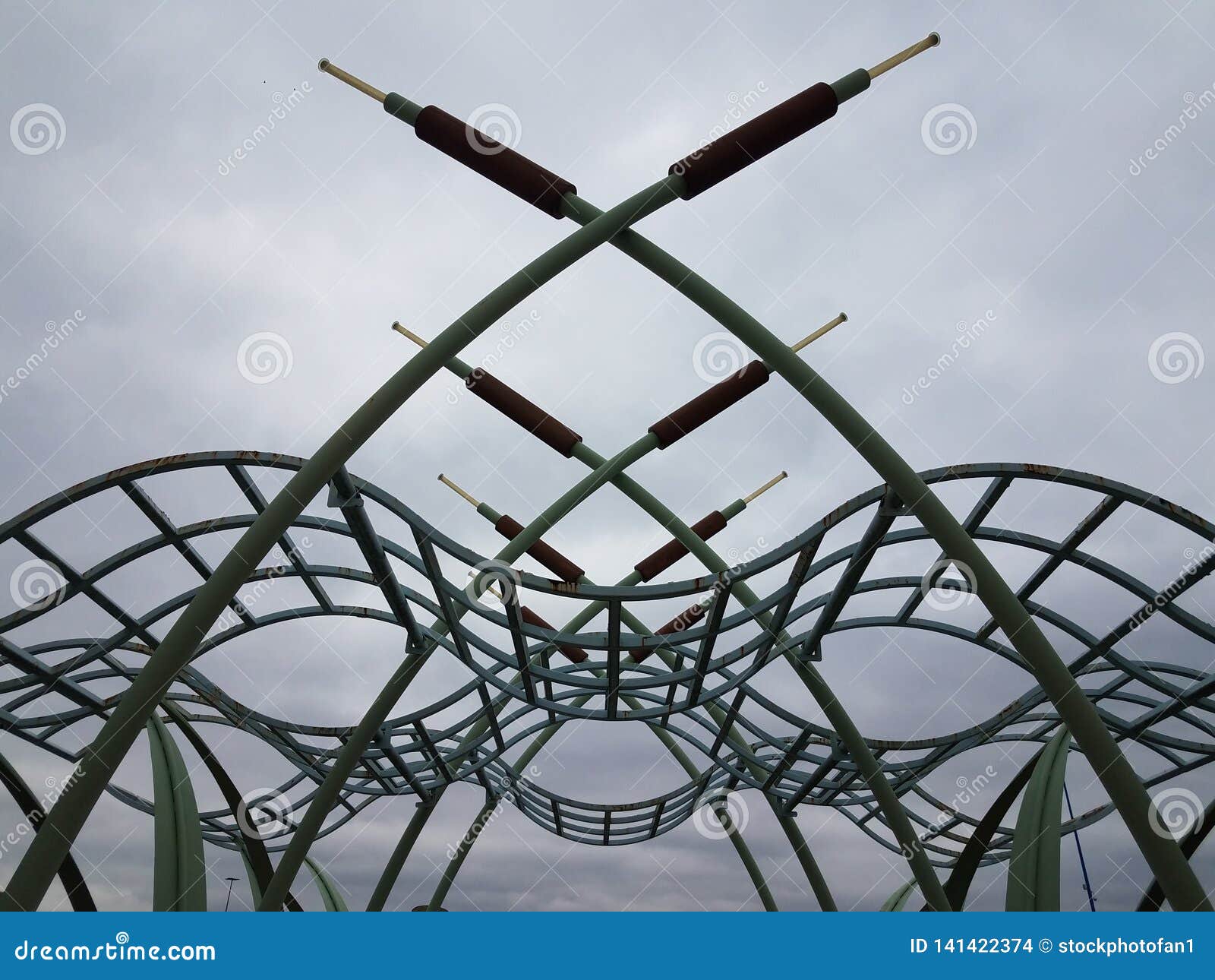 Rusty Curved Metal Structure and Clouds in the Sky Stock Photo - Image ...