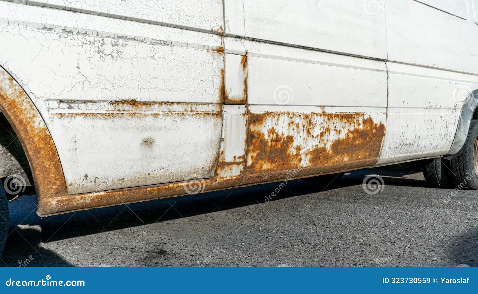 Rusty and Damaged Side of White Van. Vehicle with Visible Rust and ...