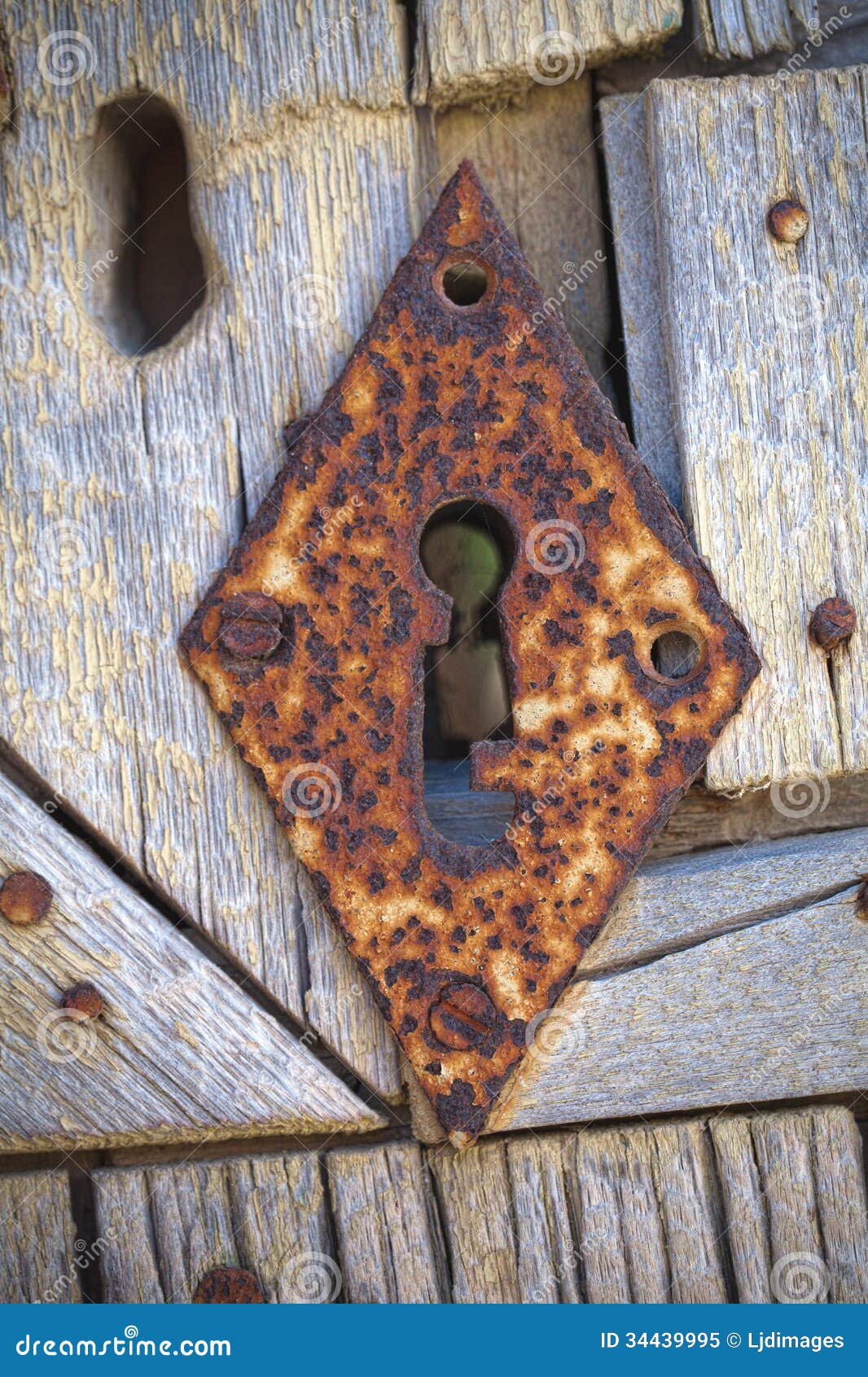 Rusty Diamond Shaped Keyhole Stock Image - Image of wood, keyhole: 34439995