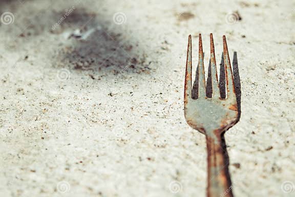 A Rusty Fork Against a Concrete Wall Stock Photo - Image of clean, rust ...