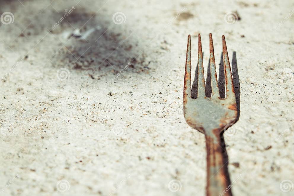 A Rusty Fork Against a Concrete Wall Stock Photo - Image of clean, rust ...
