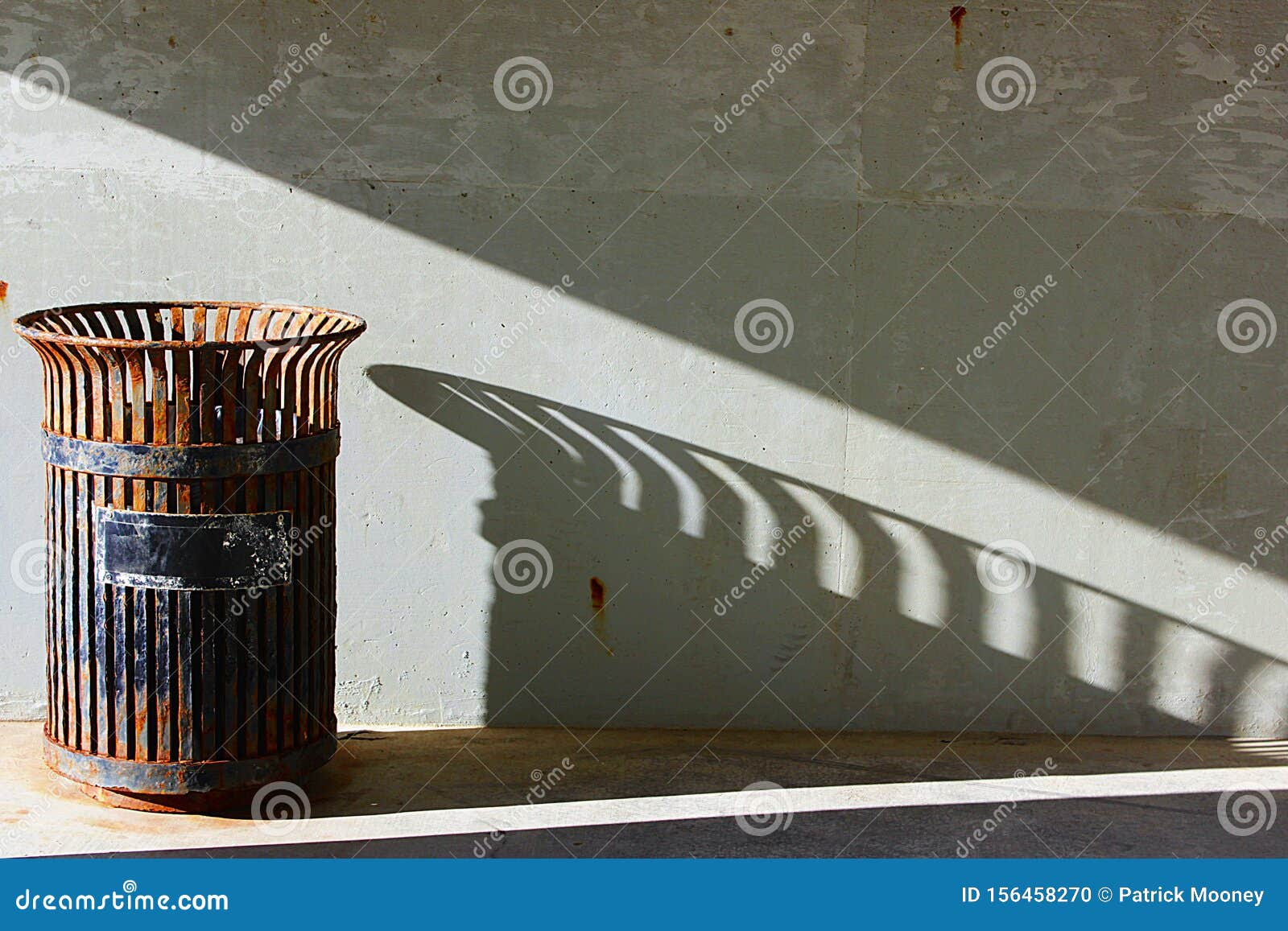 Rusty Garbage Can in Underpass Stock Photo - Image of building ...