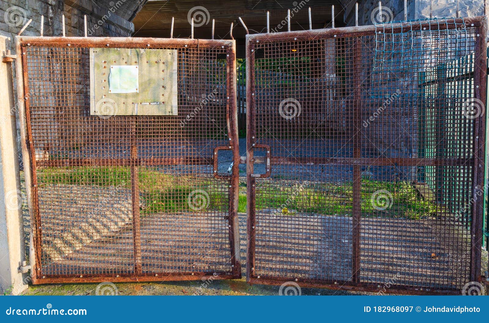 Rusty gates at a compound stock image. Image of locked - 182968097