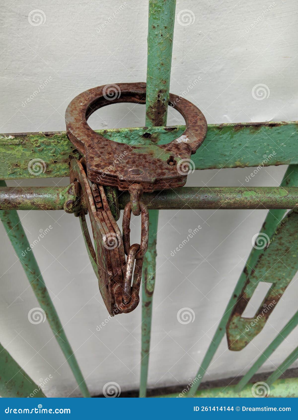 Rusty Handcuffs Used To Lock the Gate of the House Stock Photo - Image ...
