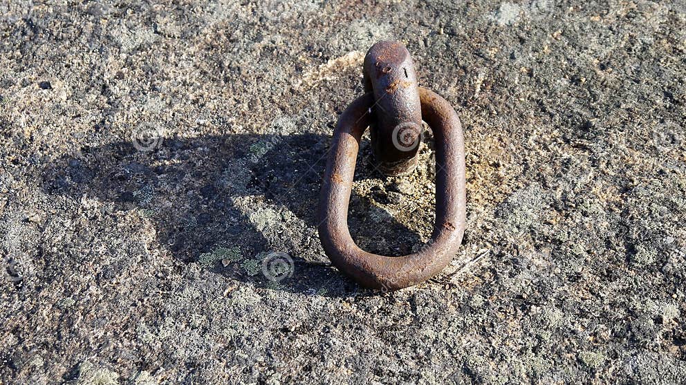 Rusty hook in a rock. stock photo. Image of sunbeam, mooring - 50338994