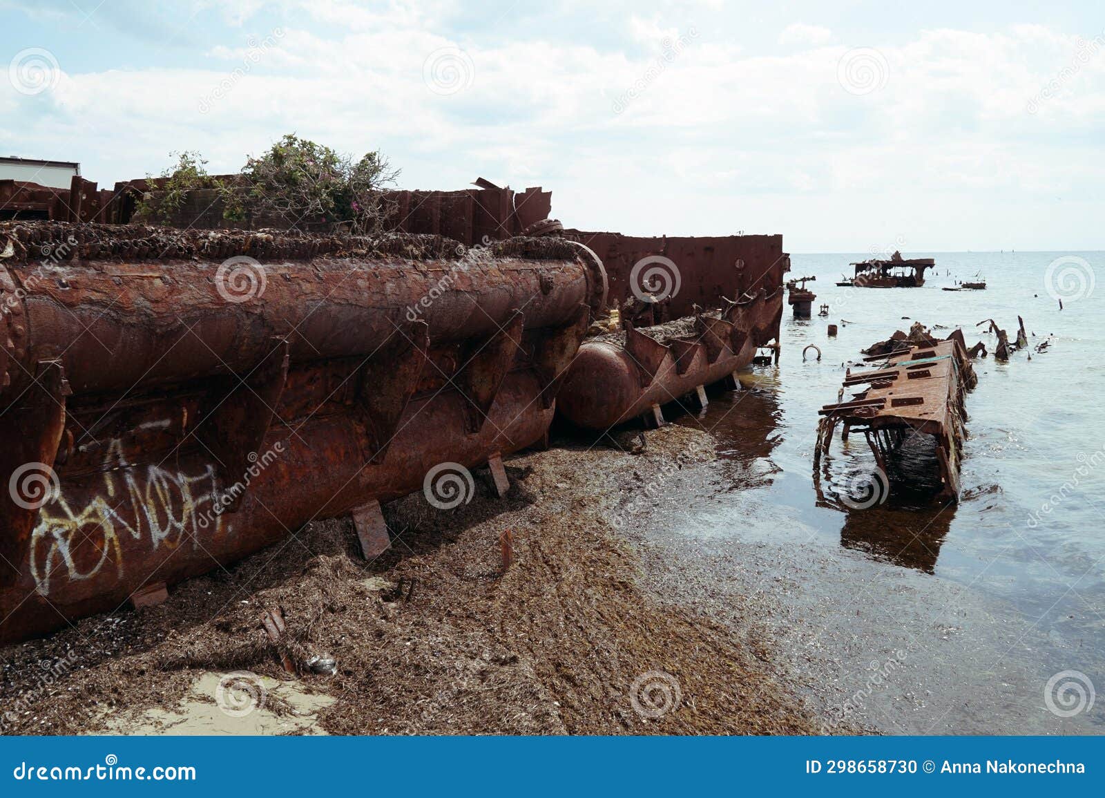 The Rusty Hull of an Old Ship on the Shore of the Baltic Sea. Stock ...