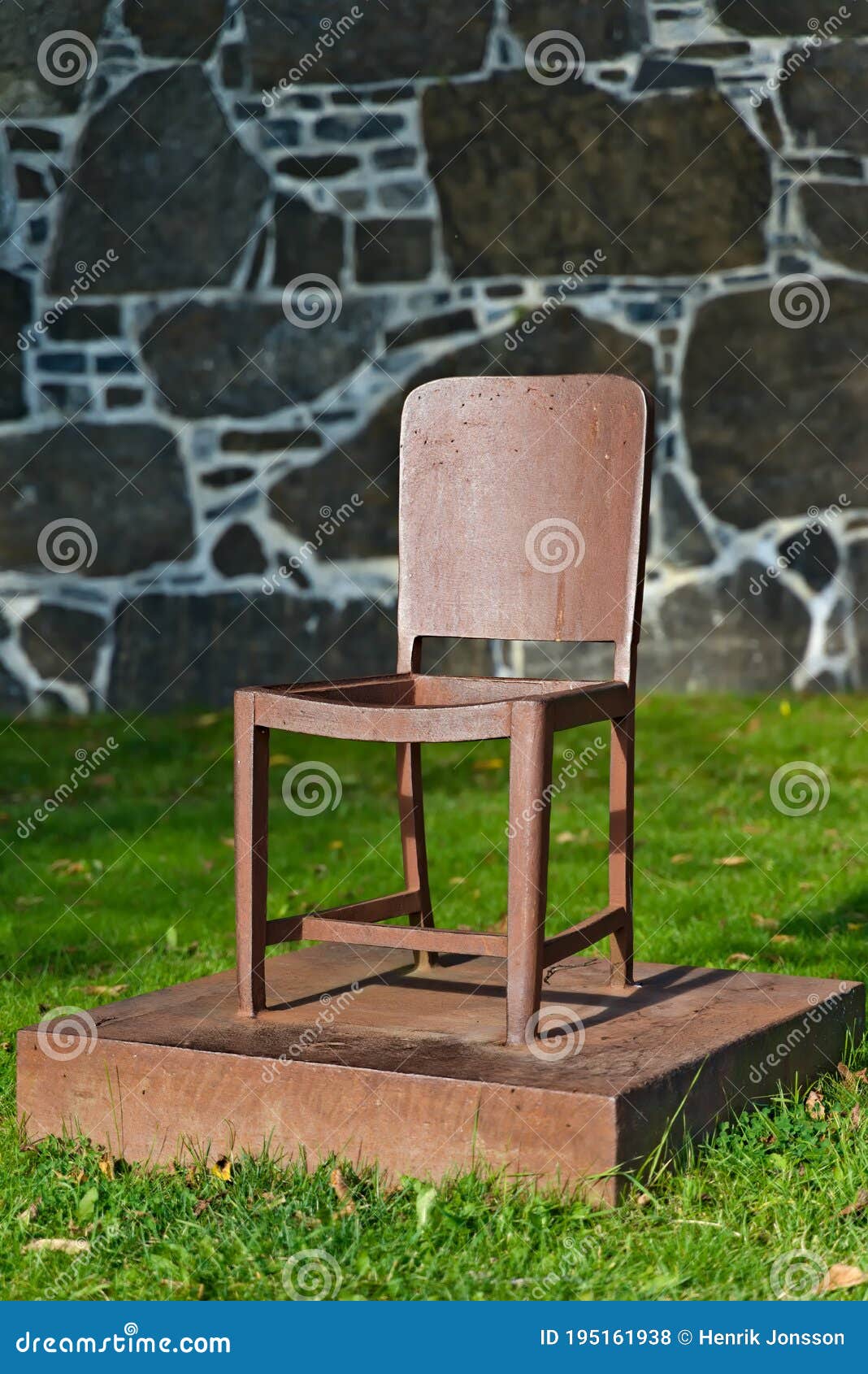 Rusty iron chair on grass stock photo. Image of empty - 195161938