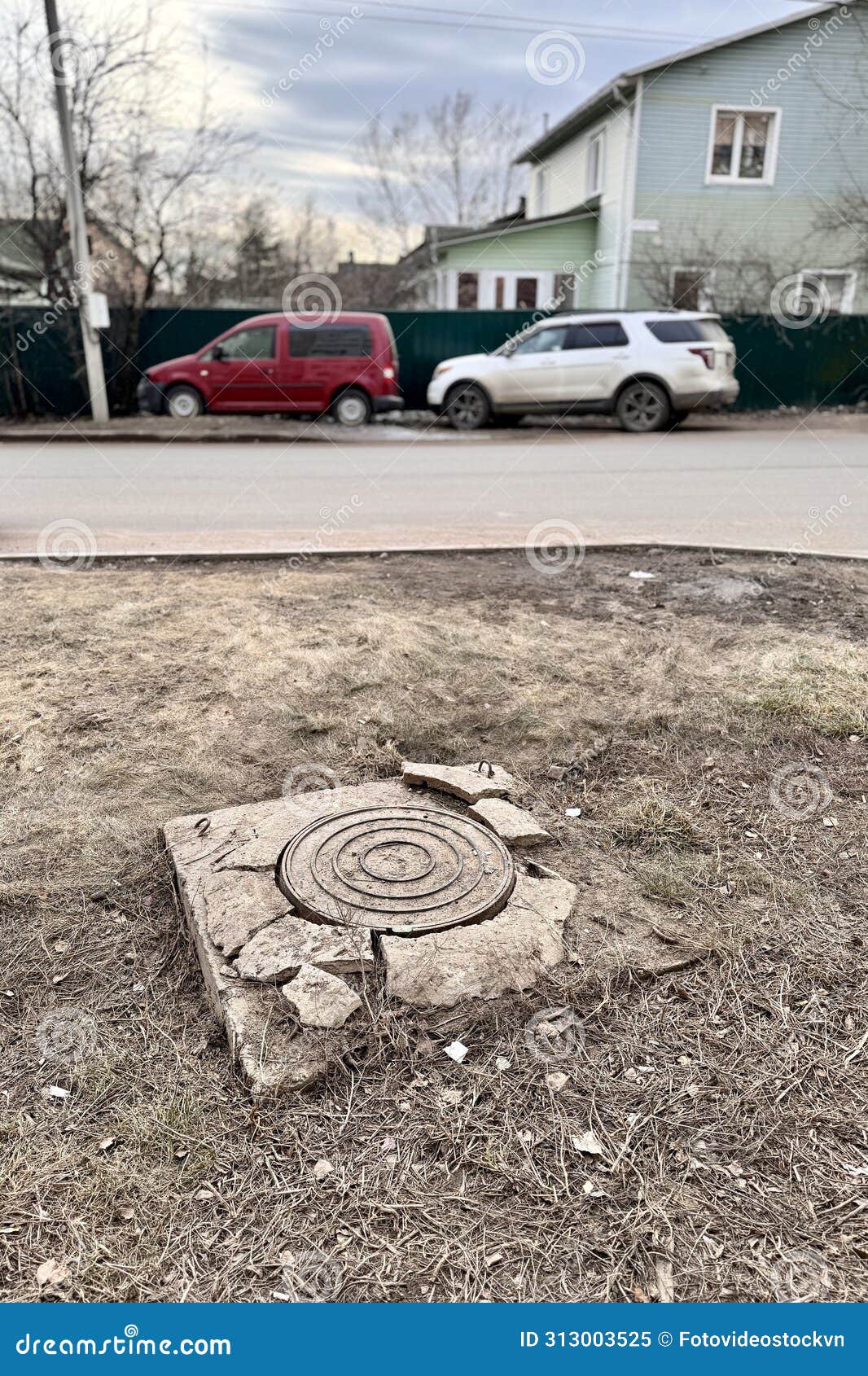 A Rusty Iron Hatch with a Pattern and a Large Gap at the Top is Mounted ...