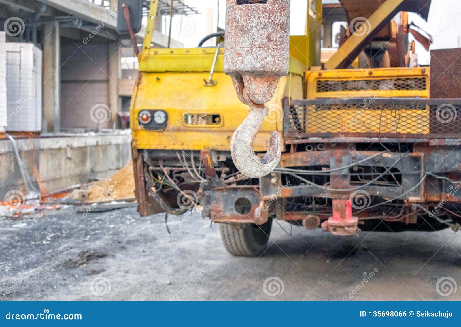 Rusty Iron Hook Hanging Off a Mobile Crane at a Construction Site ...