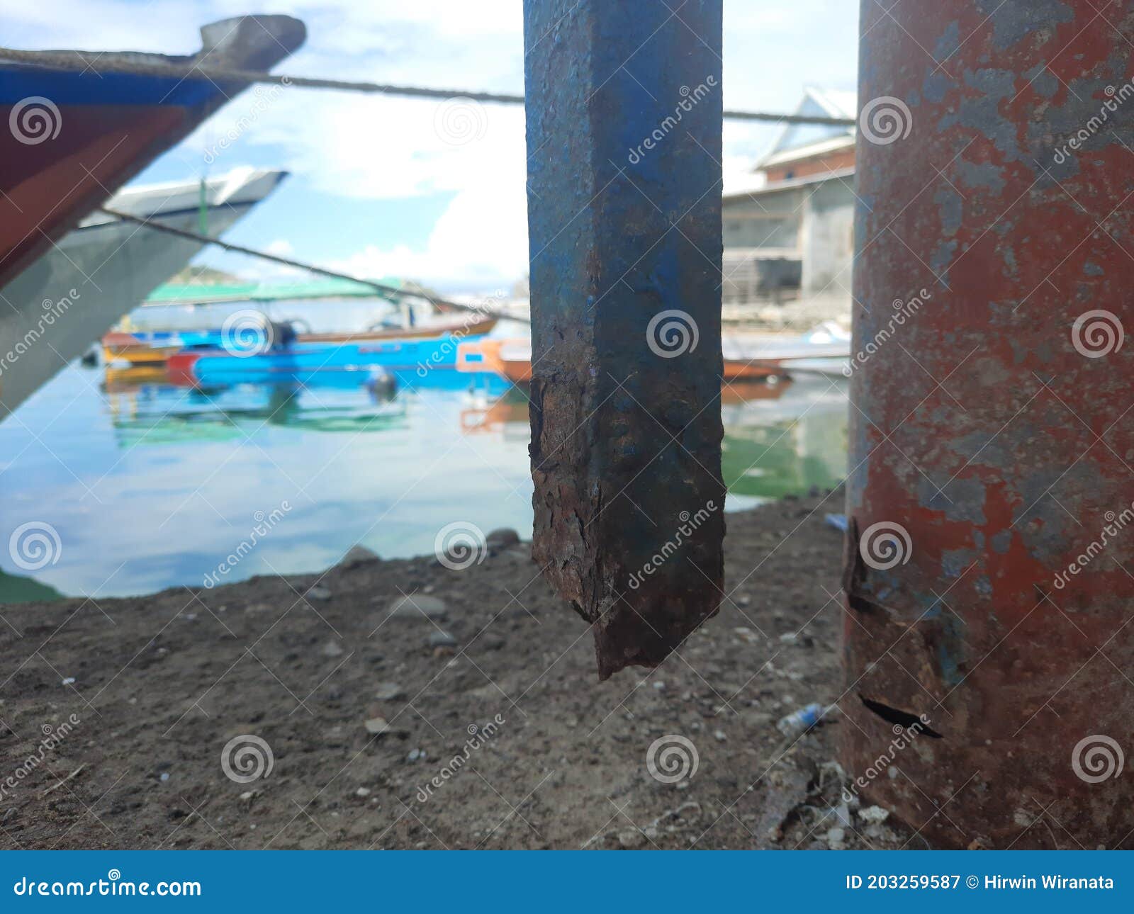 Rusty Iron Poles on the Beach Stock Image - Image of vehicle, waterway ...