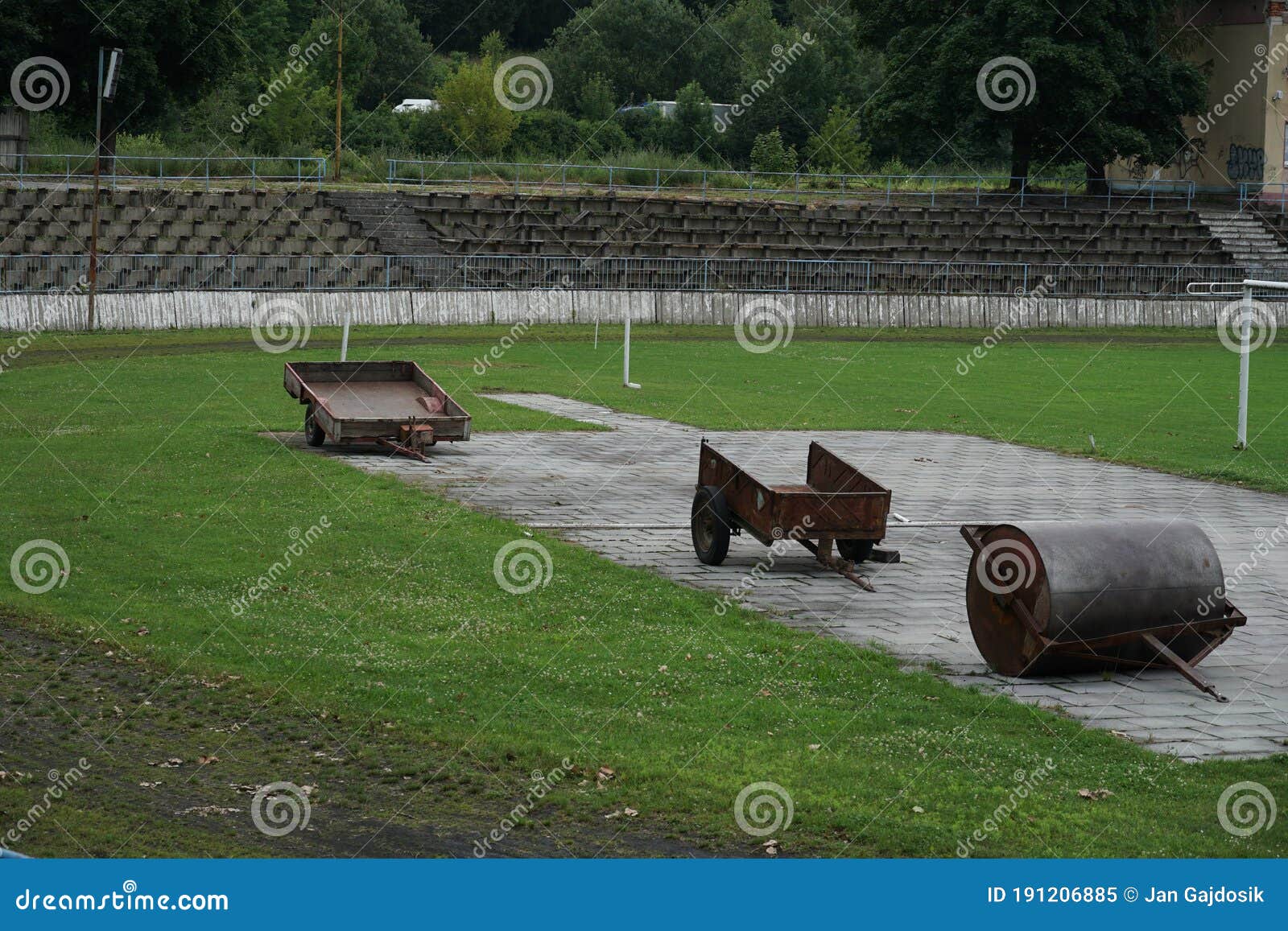 Rusty Land Roller and Two Carts Used for Maintenance of an Athletic ...