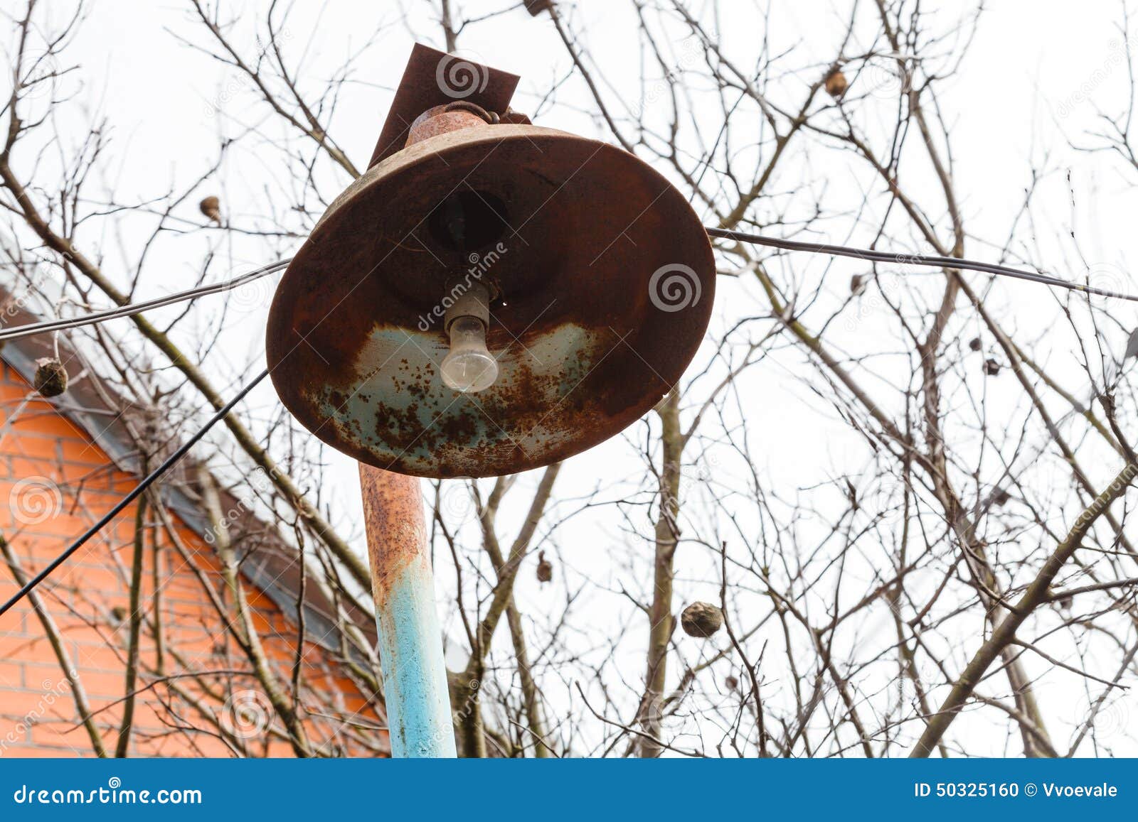 Rusty Lantern with Electric Light Bulb in Spring Stock Photo - Image of ...