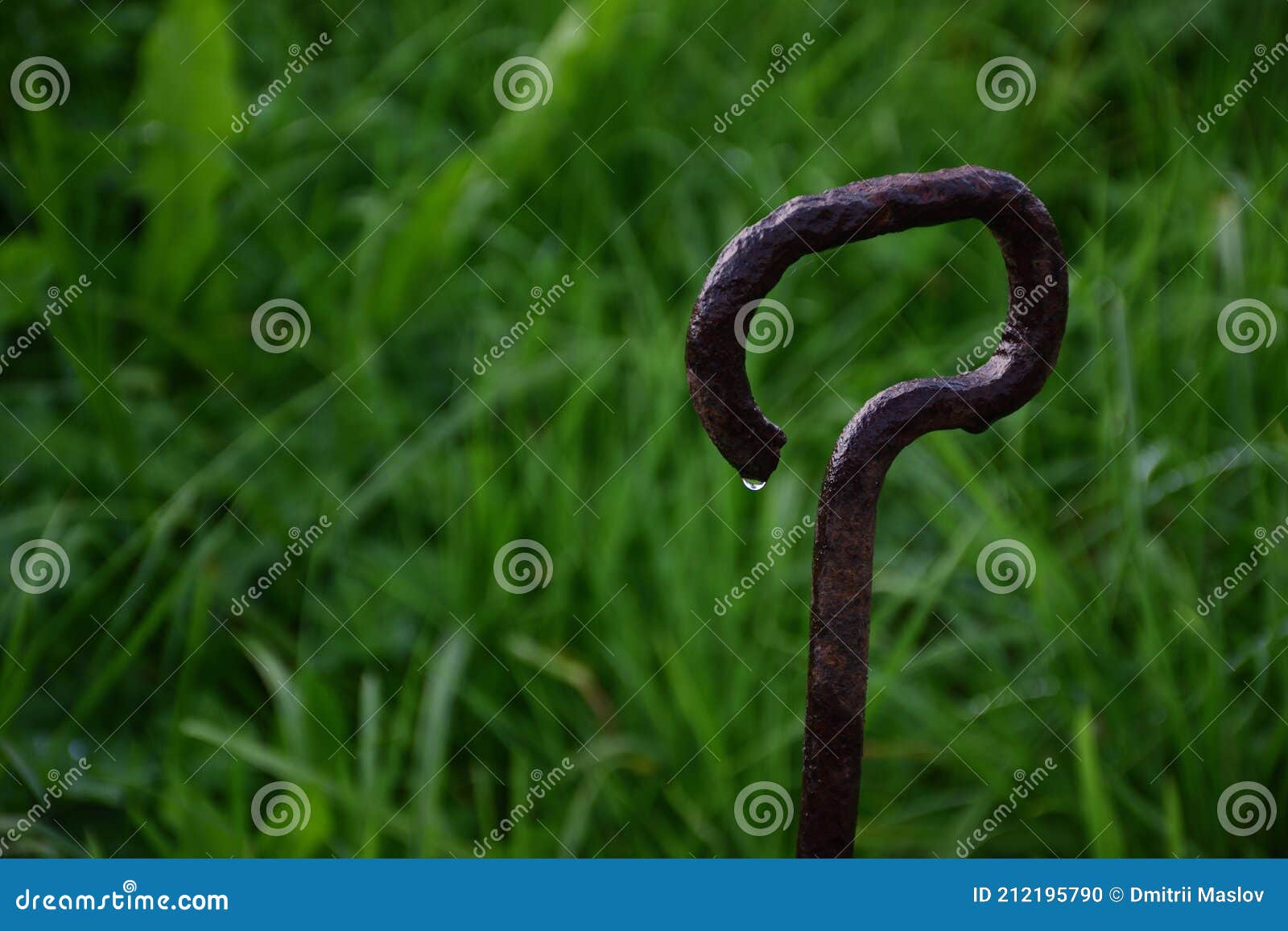A Rusty Metal Crowbar Stuck in the Ground and Rusting in the Autumn ...