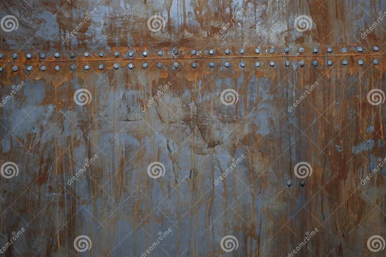 Rusty metal with rivets stock image. Image of armor, brown - 81754347