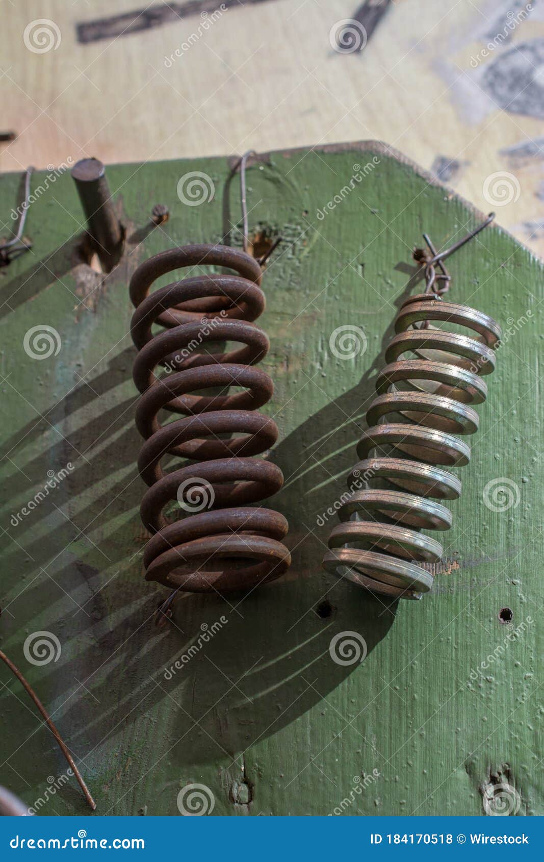 Rusty Metal Spring on the Wooden Surface Stock Photo - Image of brown ...