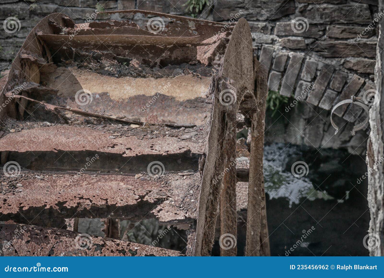 Rusty Mill Wheel in Its Traditional Place in Cutout. Stock Photo ...