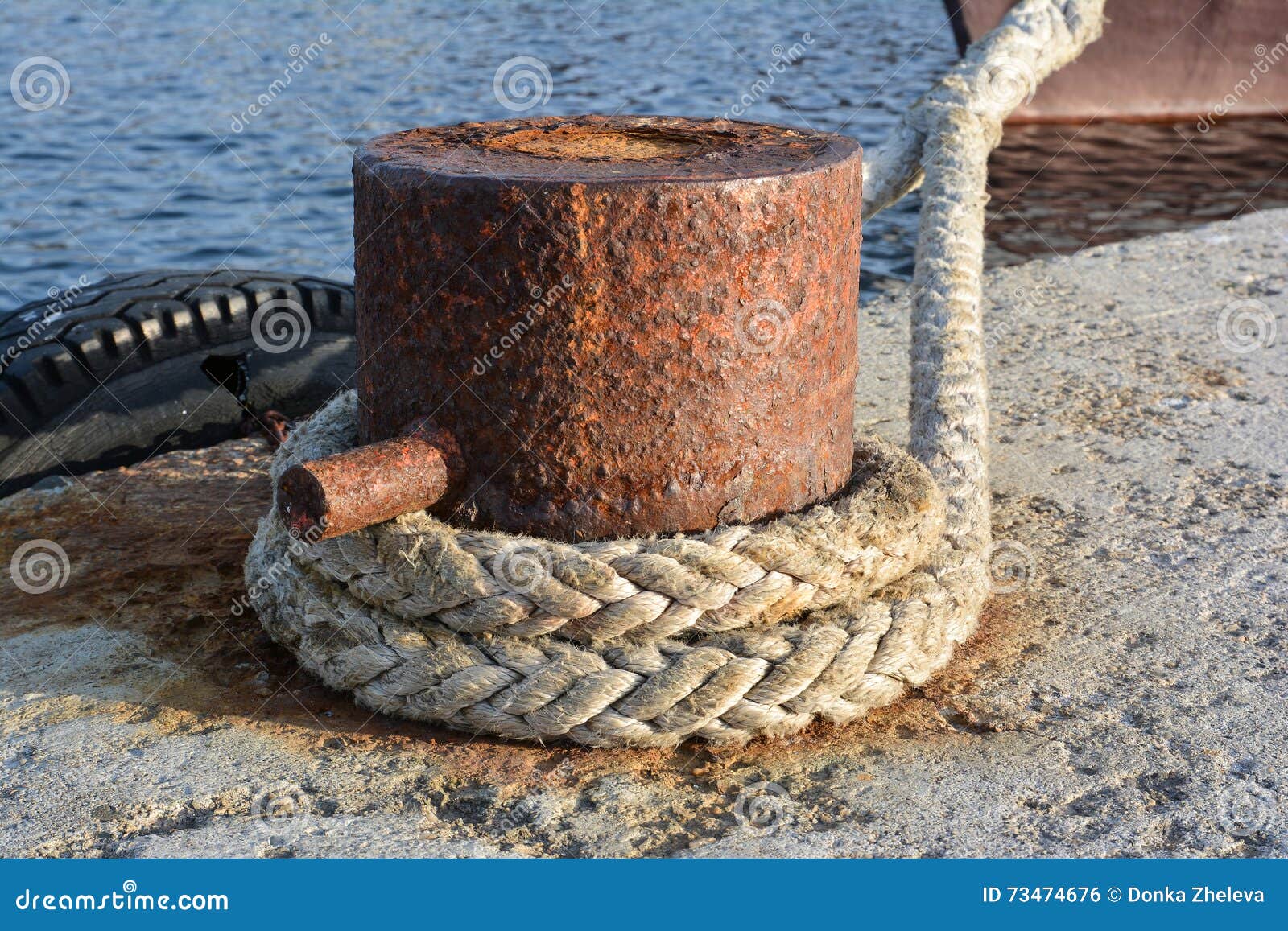 Rusty Mooring Bollard with Ship Ropes on Dock Stock Photo - Image of ...