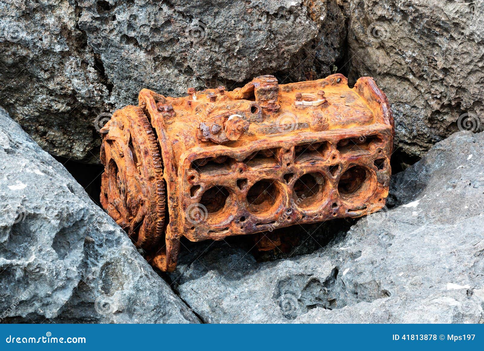 Rusty motor in the rocks stock photo. Image of stones - 41813878