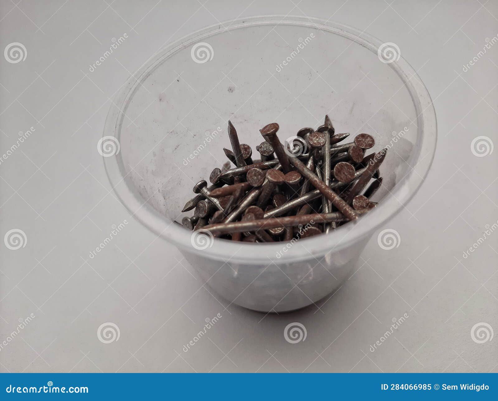 Rusty Nail in a Transparent Plastic Bottle Stock Image - Image of nail ...