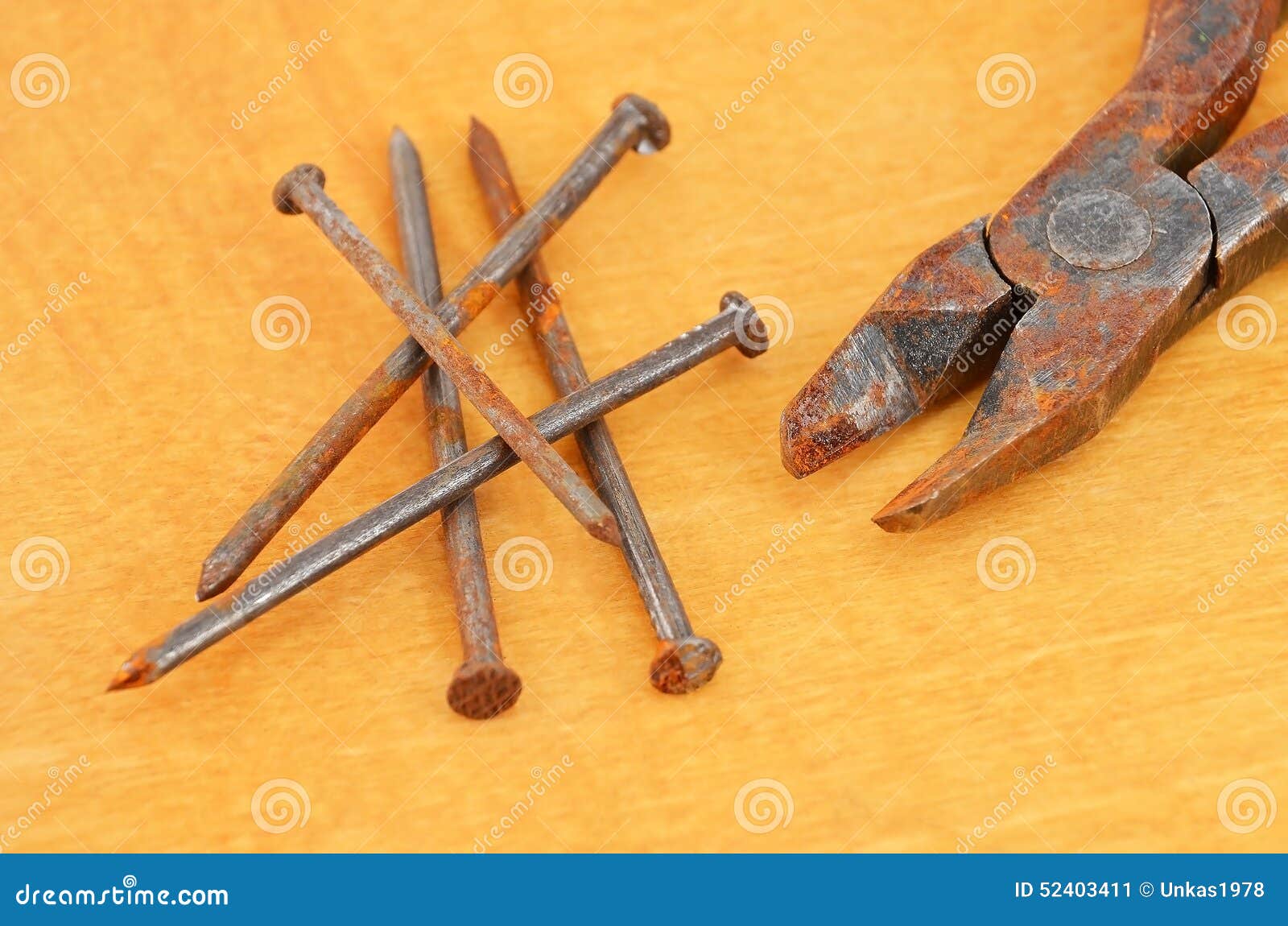Rusty nail and wire cutter stock image. Image of fasten - 52403411