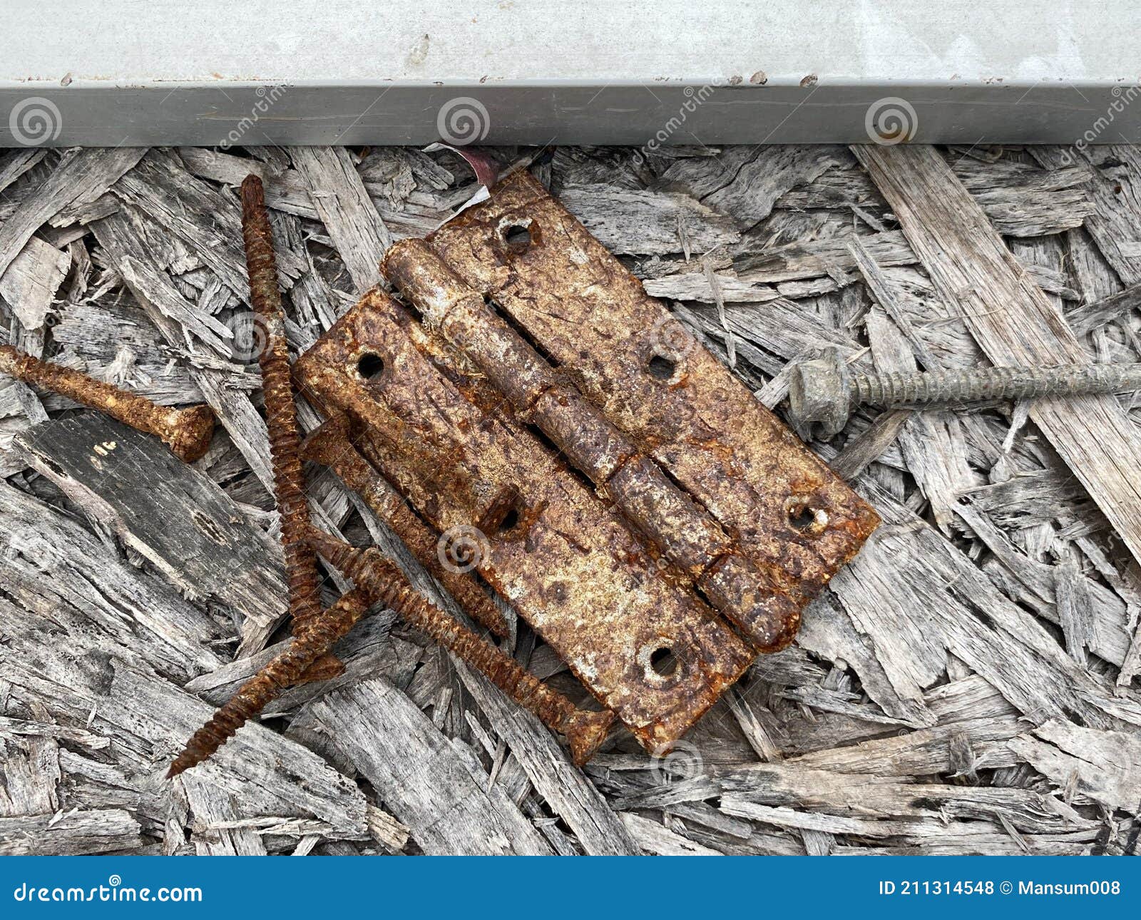 Rusty nut on wooden floor stock photo. Image of close - 211314548