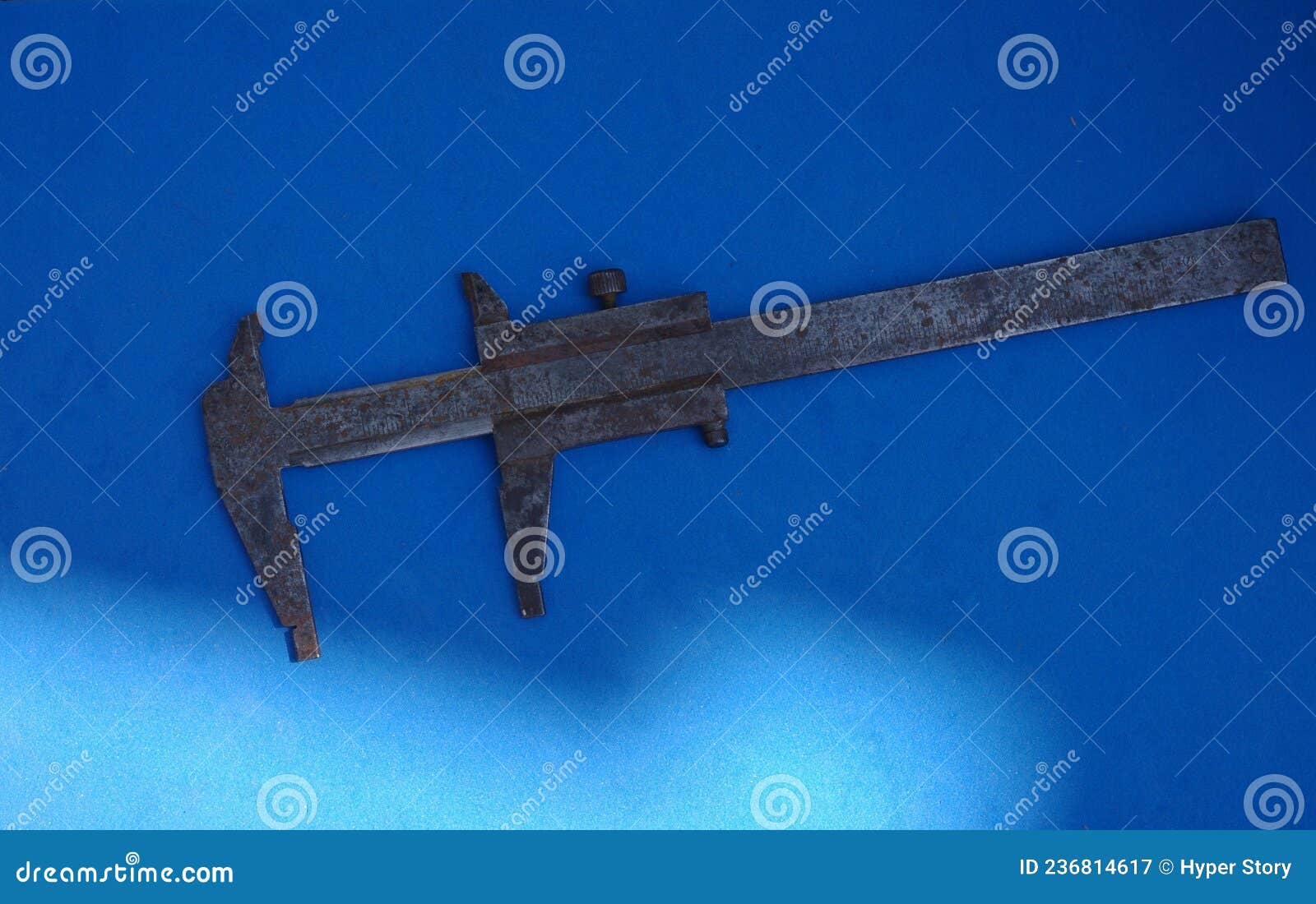 Rusty Old Caliper on a Blue Background. Device for Reading Out a ...